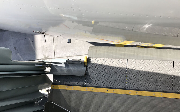 Hinged bumper for passenger boarding bridges